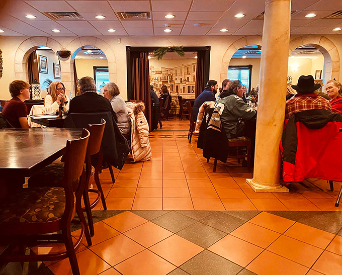 The bustling dining room speaks volumes—these aren't just customers, they're returning pilgrims at the altar of proper Italian cooking.