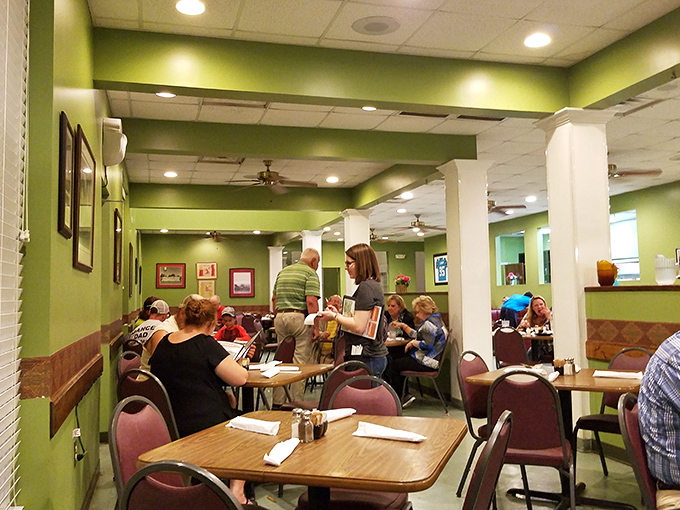 A bustling dining room where strangers become neighbors, united by the universal language of "pass the gravy, please."