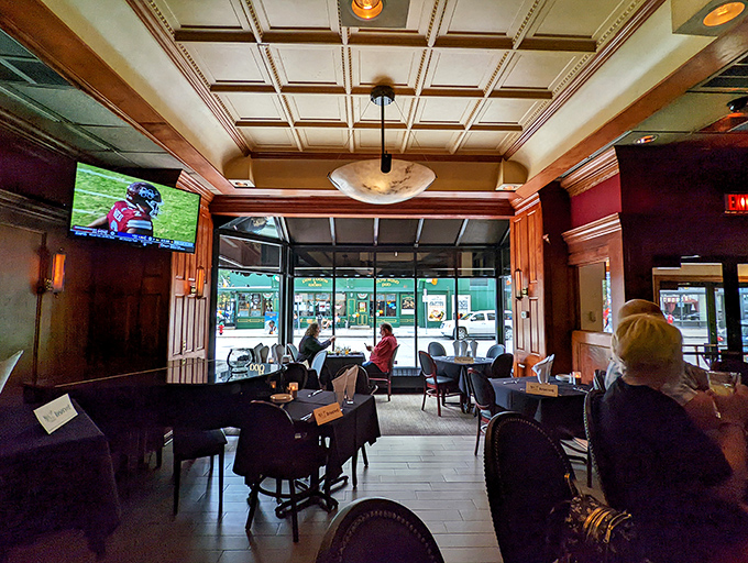 The front dining area offers a glimpse of Milwaukee street life while you remain cocooned in steakhouse luxury—the best of both worlds.