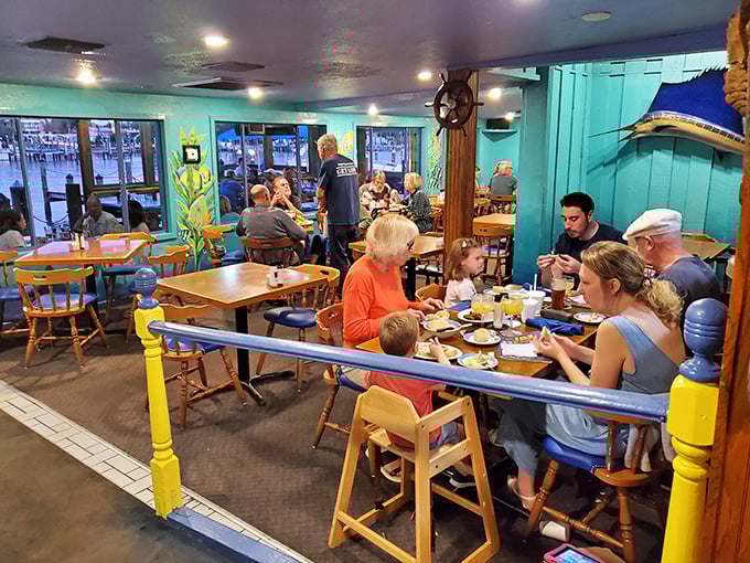Families gathered around wooden tables, enjoying seafood treasures—this isn't just dining, it's the communal Florida experience we all crave.
