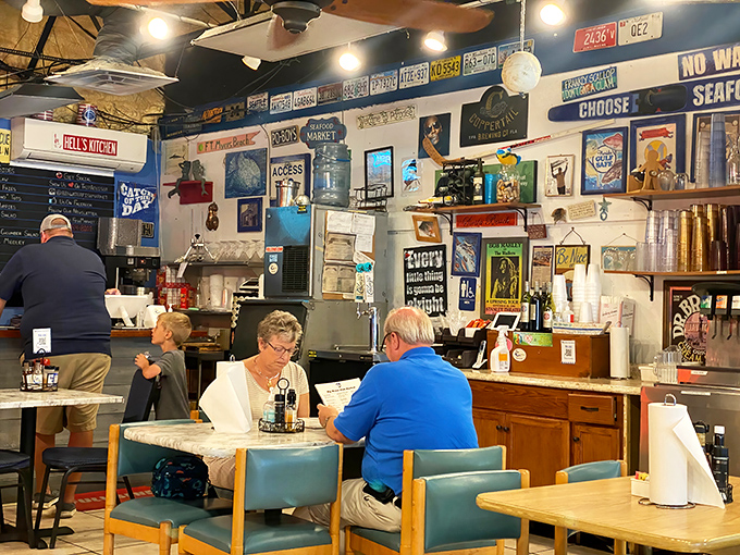 Diners enjoying the simple pleasure of great seafood in unpretentious surroundings. No white tablecloths needed when the food speaks this eloquently. 
