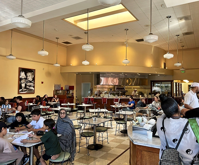 Families gather around marble tables, creating memories one spoonful at a time in this temple of frozen delight.