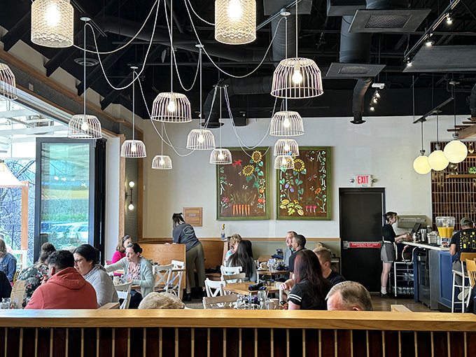 Modern Southern hospitality in action—where exposed ductwork meets warm conversation and nobody leaves hungry or unsmiling.