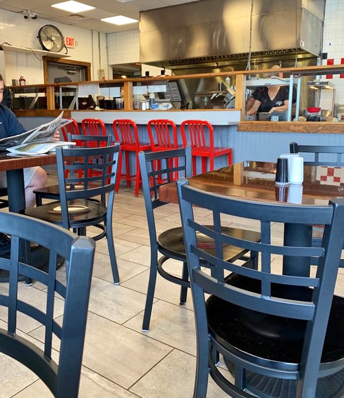 Blue chairs invite you to stay awhile, while red counter stools suggest you might want to hurry up – the perfect dining contradiction.