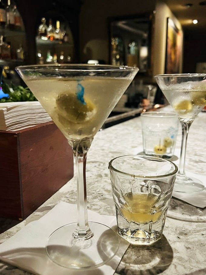 Martinis so cold they make your teeth hurt—served with olives that have soaked up just enough gin to make them dangerous.
