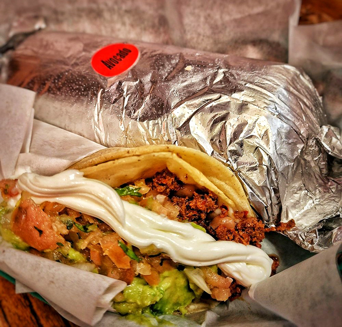 The foil peels back to reveal layers of flavor that would make a geologist jealous. Avocado, sour cream, and perfectly grilled meat create edible art.