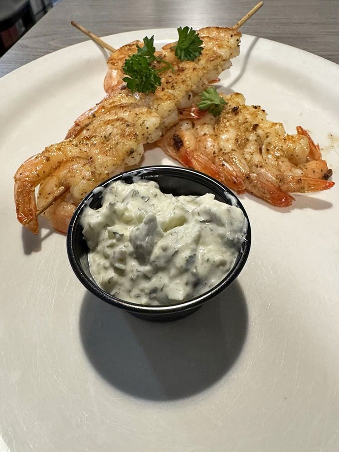 Shrimp skewers that look like they jumped straight from Gulf waters onto the grill. That herb-flecked tartar sauce isn't just a condiment—it's a companion.