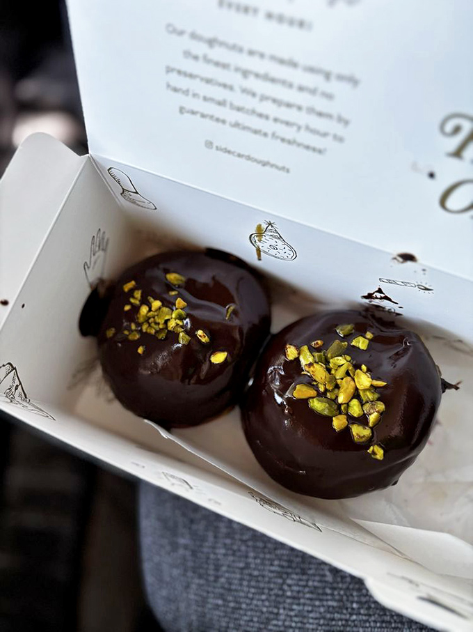 Chocolate donuts adorned with pistachios—a sophisticated pairing that makes your average donut seem like it never really tried.