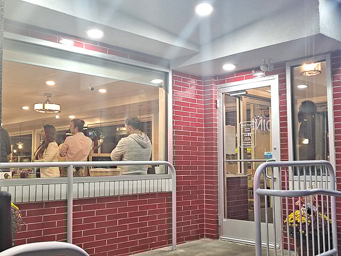 The entrance to flavor town isn't just welcoming—it's framed in classic red brick and illuminated promise. Even the railings look excited to be here.