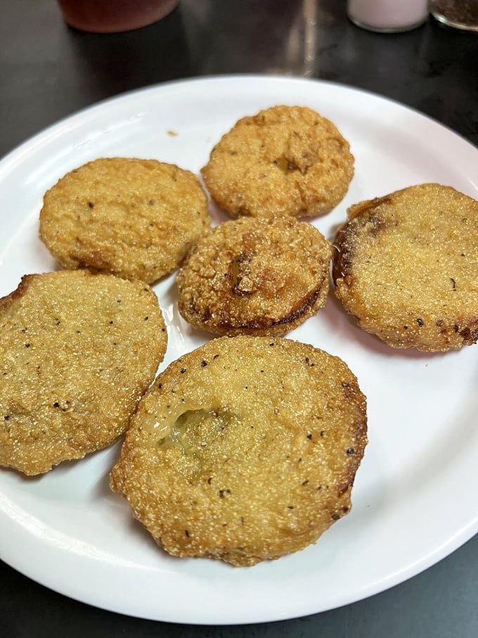 Golden-fried discs of Southern comfort that crunch like autumn leaves, these fried green tomatoes are the unsung heroes of Mary's appetizer selection.
