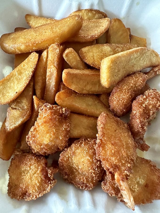 Crispy fried shrimp and steak fries that remind you why sometimes the classics don't need reinventing—they just need respecting.