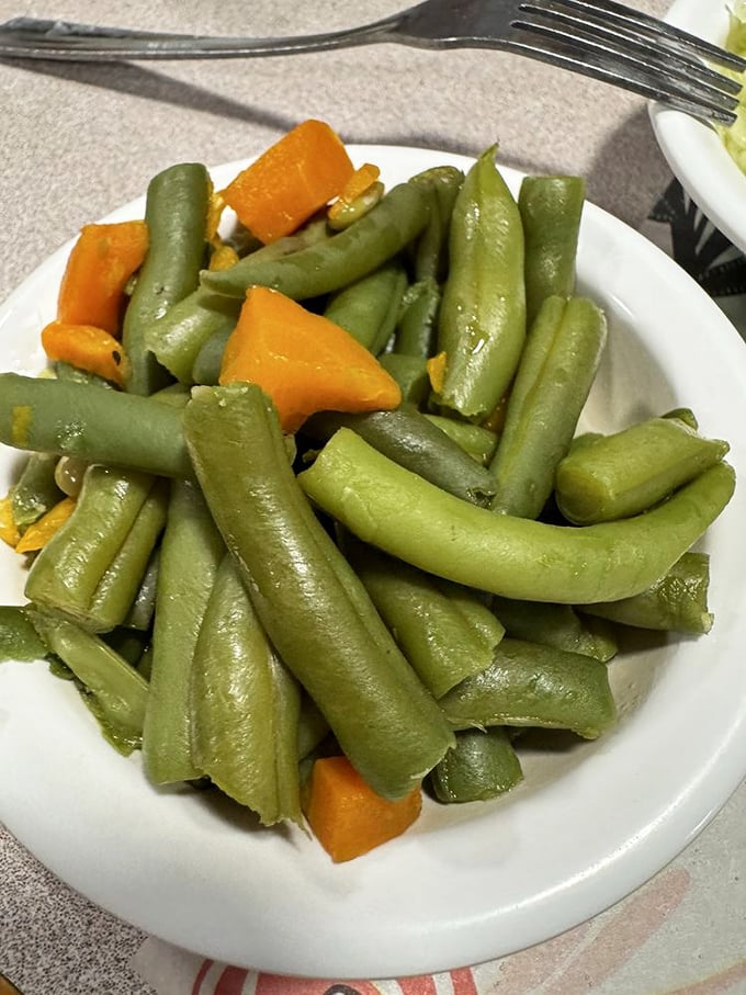 Green beans that haven't been overthought or "elevated"—just properly cooked vegetables that remember their purpose on the plate.