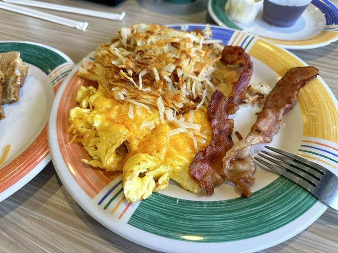 Breakfast dreams are made of this—fluffy eggs, perfectly crisped hash browns, and bacon that should win awards for "Most Likely to Make You Swoon."