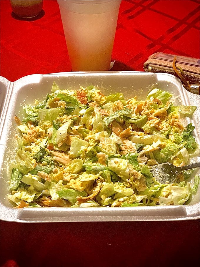 A salad that doesn't apologize for being healthy—it's too busy showing off its fresh ingredients and vibrant colors.