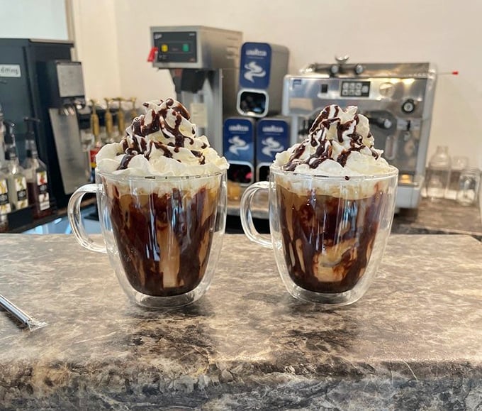 These mochas aren't just wearing whipped cream hats—they're sporting full-on chocolate-drizzled crowns fit for caffeinated royalty.