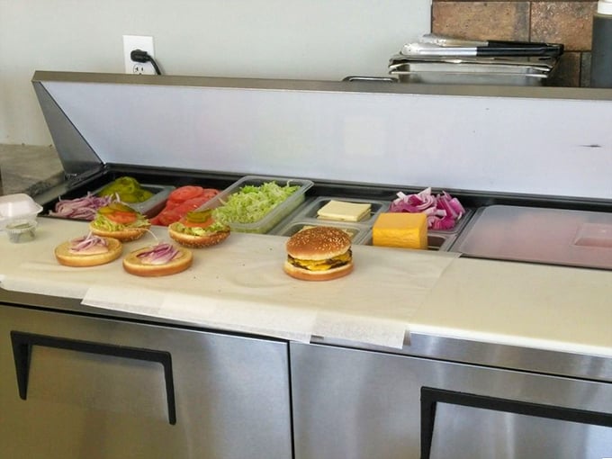 Where burger magic happens. Fresh ingredients lined up like soldiers ready for delicious duty—a glimpse behind the curtain of flavor.