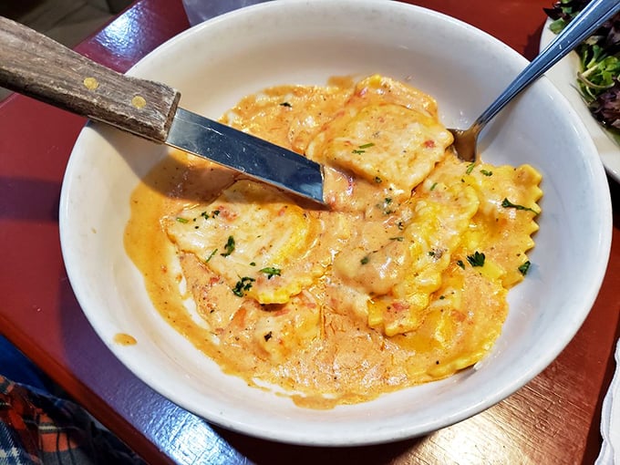 This lobster ravioli isn't just dinner—it's a sunset-colored sea of creamy indulgence that makes you want to lick the bowl.