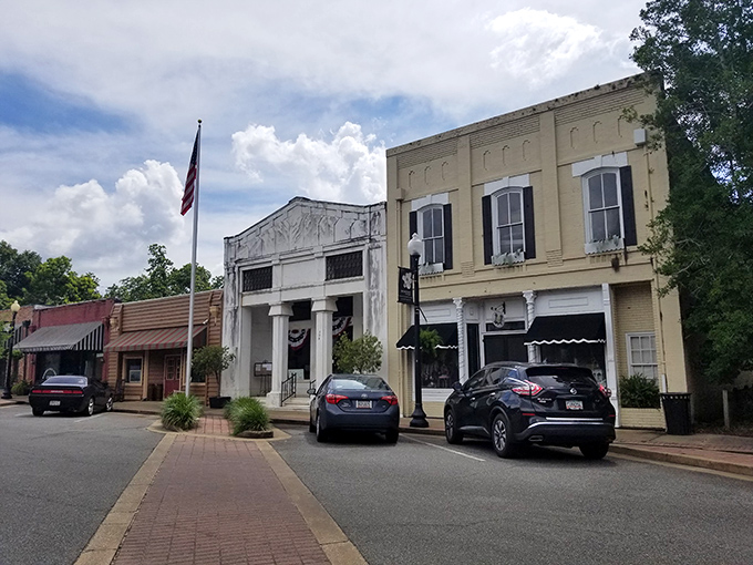 These historic facades aren't just preserved—they're living their best life, proudly displaying the architectural equivalent of a well-maintained vintage Cadillac.