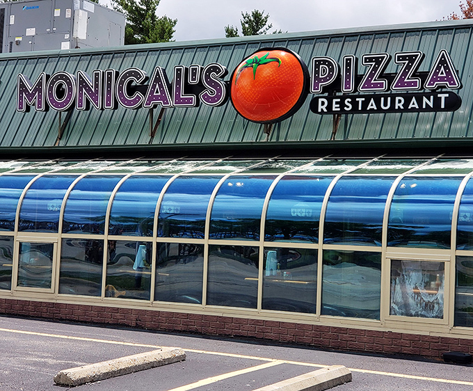 Monical's Pizza announces itself with a tomato the size of a small planet – subtlety isn't on the menu, but good pizza is.