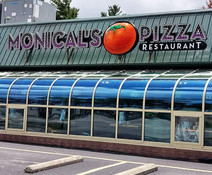 Monical's Pizza announces itself with a tomato the size of a small planet – subtlety isn't on the menu, but good pizza is.