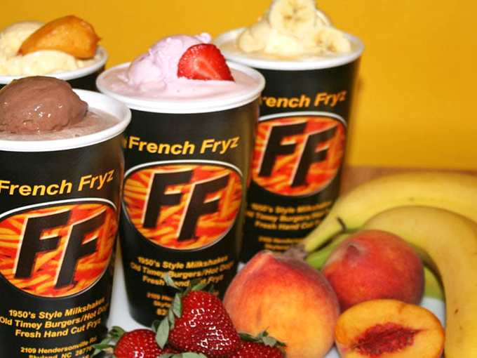 Milkshakes so thick they laugh at straws – nostalgic sips of creamy heaven topped with fresh fruit that didn't come from a factory.