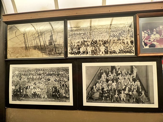These vintage photographs lining the walls aren't just decoration—they're windows into America's railroad past, telling stories of journeys long completed.