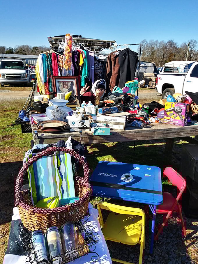 The beautiful chaos of flea market merchandising—where household items, clothing, and unexpected treasures create a shopper's scavenger hunt.