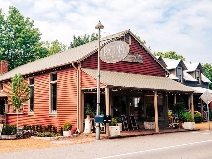 Patina's weathered red siding isn't manufactured charm – it's the real patina of time, housing treasures waiting to be discovered.