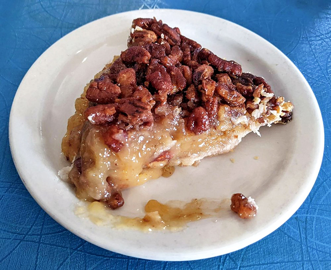 Pecan pie that's more than just sweet – it's a textural masterpiece with gooey filling and crunchy nuts. The kind of dessert that makes you seriously consider ordering a second slice.