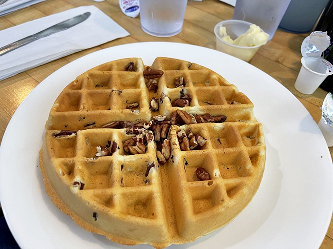 The pecan waffle – where crispy meets nutty in a breakfast symphony that makes you wonder why you'd ever settle for toast again.