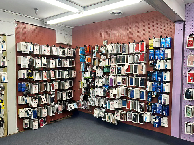 The modern bazaar—where phone cases hang like technological tapestries in a gallery of digital accessories.