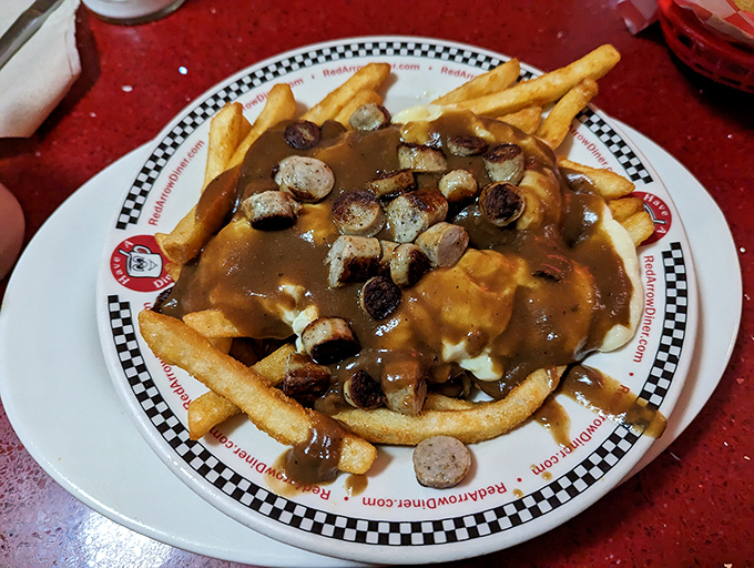 Poutine gets the New Hampshire treatment with sliced sausage joining the gravy and fries party. Comfort food that hugs you from the inside.