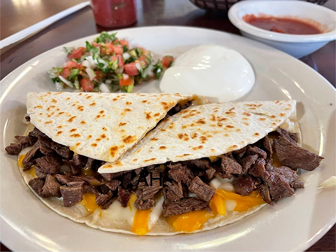 This quesadilla isn't playing games—it's serious about delivering maximum flavor with minimal fuss. The steak is the star in this tortilla theater.