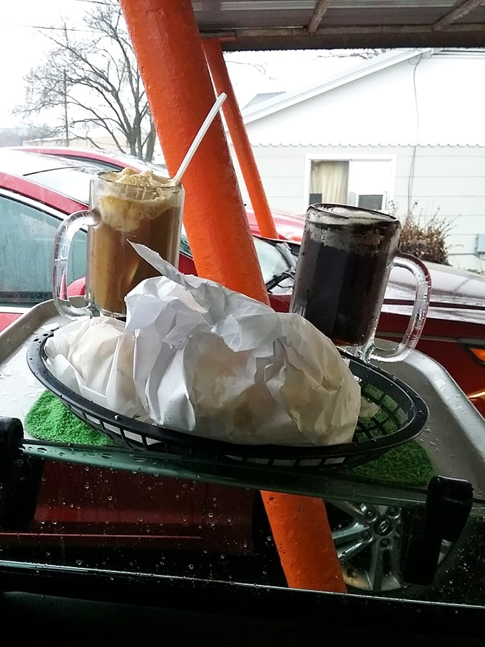 Root beer floats served car-side: where creamy vanilla ice cream meets frothy root beer in a frosty mug that weighs as much as your childhood memories.