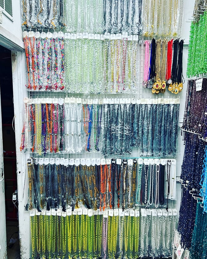 Religious items displayed alongside souvenirs – covering both your spiritual and souvenir needs in one convenient stop.