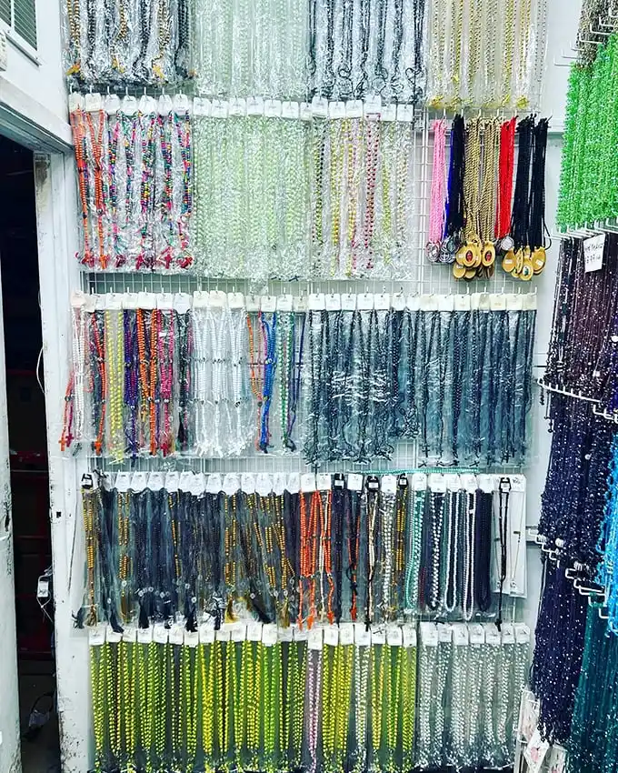 Religious items displayed alongside souvenirs – covering both your spiritual and souvenir needs in one convenient stop.