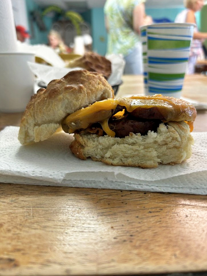 A breakfast sandwich that understands the importance of proper meat-to-bread ratio – engineering perfection on a humble biscuit.