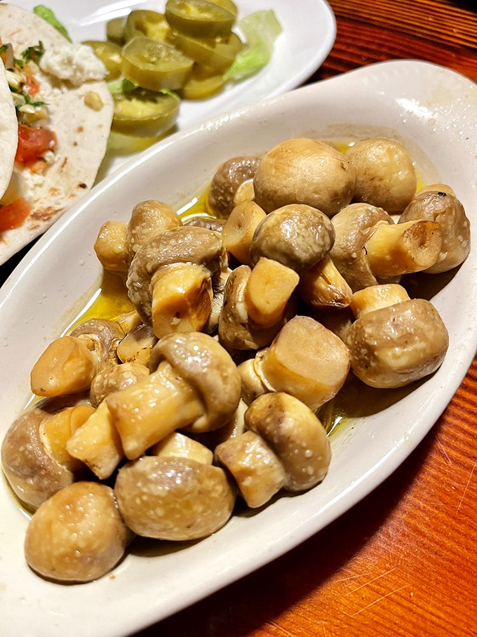 These mushrooms aren't just sautéed—they're transformed. Swimming in buttery goodness, they've found their true calling as steak's perfect companion.
