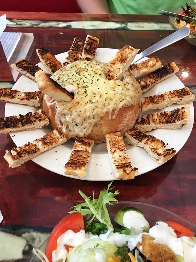 Bread bowl brilliance! Creamy seafood goodness surrounded by toasted bread soldiers ready for dipping duty. Carb-loading never looked so justified.