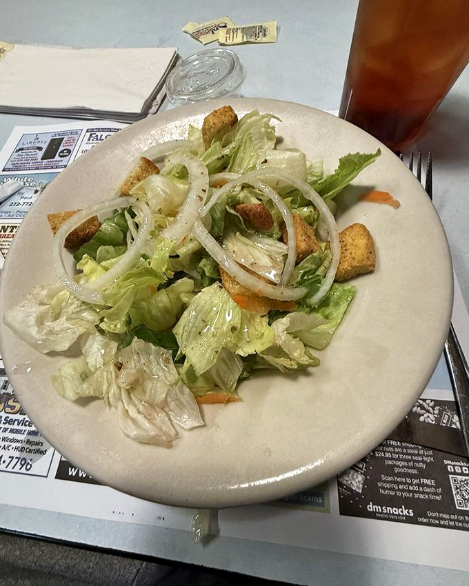Even the humble side salad gets the respect it deserves here—crisp lettuce, fresh onions, and croutons that actually crunch. No sad salad syndrome in sight. 