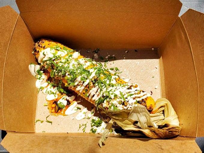 Elote goes to smoke school—charred corn dressed in crema, cotija, and herbs creates a side dish that sometimes steals the spotlight.