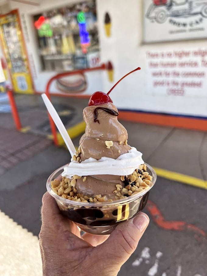 This sundae doesn't just satisfy your sweet tooth – it creates a monument to chocolate, whipped cream, and the joy of roadside indulgence.