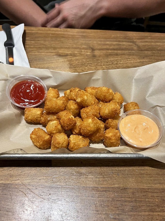 These aren't just tater tots—they're childhood memories upgraded. Perfectly golden cubes of potato nostalgia that somehow taste even better than you remember.