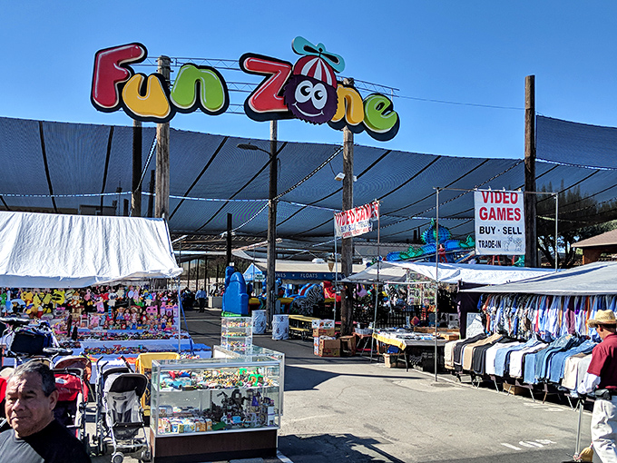 The Fun Zone sign promises exactly what it delivers—a carnival atmosphere where joy is the main commodity being traded.