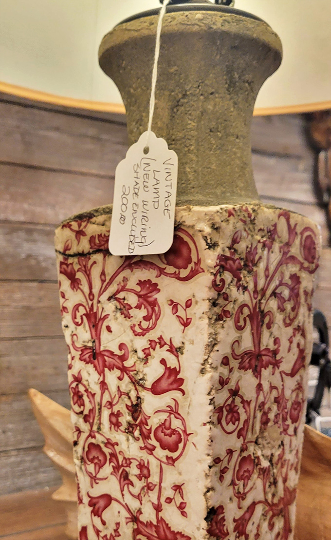 This isn't just a vintage lamp – it's a conversation piece with a tag that hints at its journey from someone's elegant parlor to your treasure-hunting hands.