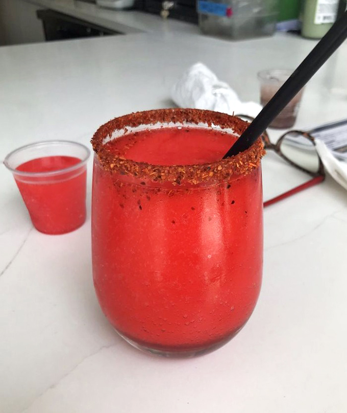 This watermelon margarita doesn't just quench thirst—it throws a fiesta for your taste buds, complete with a spicy rim as the bouncer.