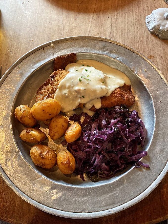 Wiener schnitzel with potatoes and red cabbage—a European vacation for your mouth without the hassle of passport control.