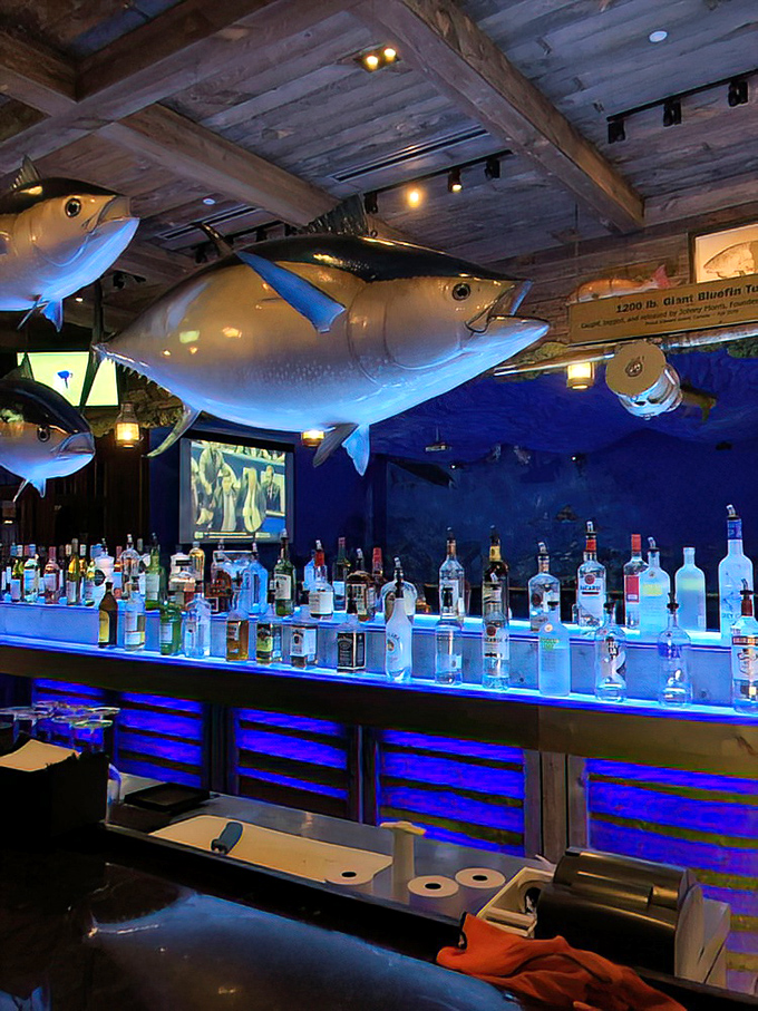 The bar that launched a thousand ships—and cocktails. Those fish overhead have seen some strikes, spares, and spectacular wipeouts.