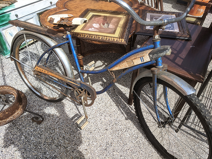 This vintage blue bicycle isn't just transportation—it's a time machine on wheels, ready to pedal some lucky buyer back to simpler days.