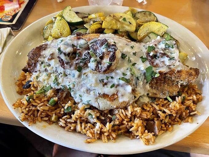 Blackened fish that's found the perfect balance between spice and tenderness, lounging on a bed of rice like it's on vacation in flavor country.